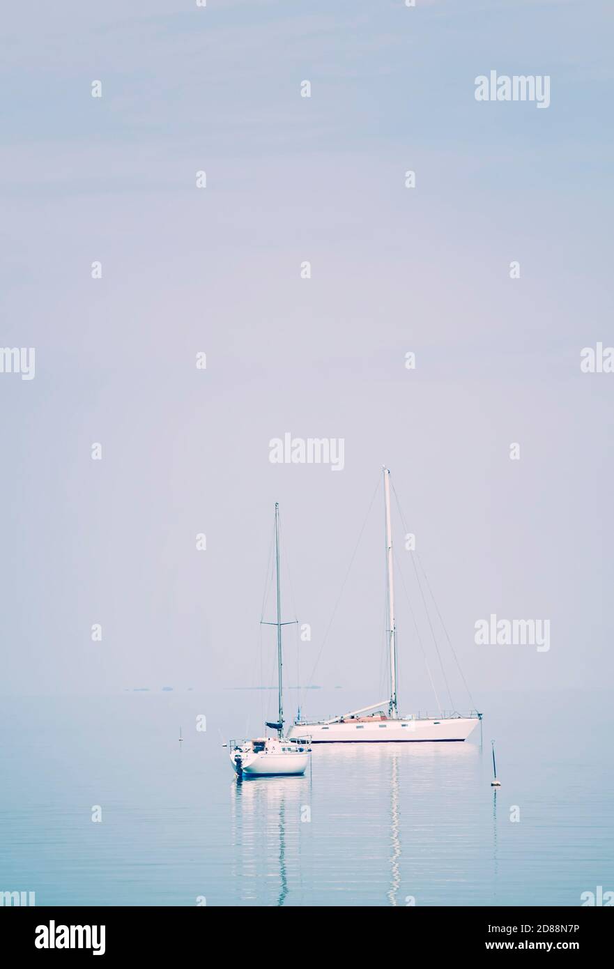 Sailing yacht in the blue sea with sails down, summer landscape Stock ...