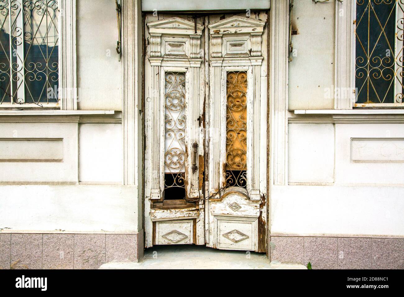 image of destroyed wooden doors with forged inserts of an old mansion ...