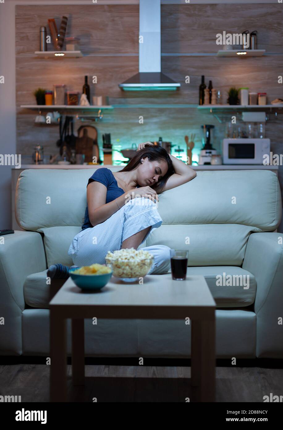 Woman watching tv lazy hi-res stock photography and images - Alamy