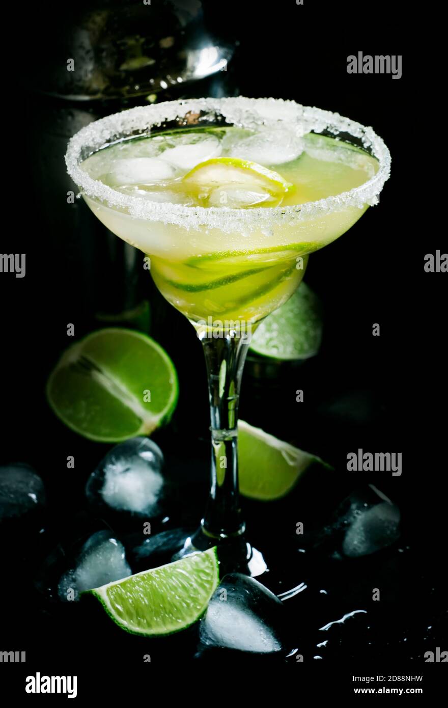 Lime Daiquiri cocktail in glass, black bar counter background ...
