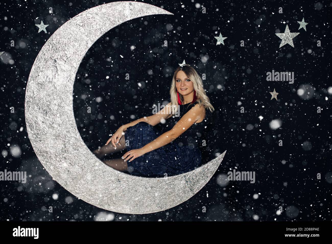 Picture of a young girl posing in the scenery of a big moon Stock Photo ...