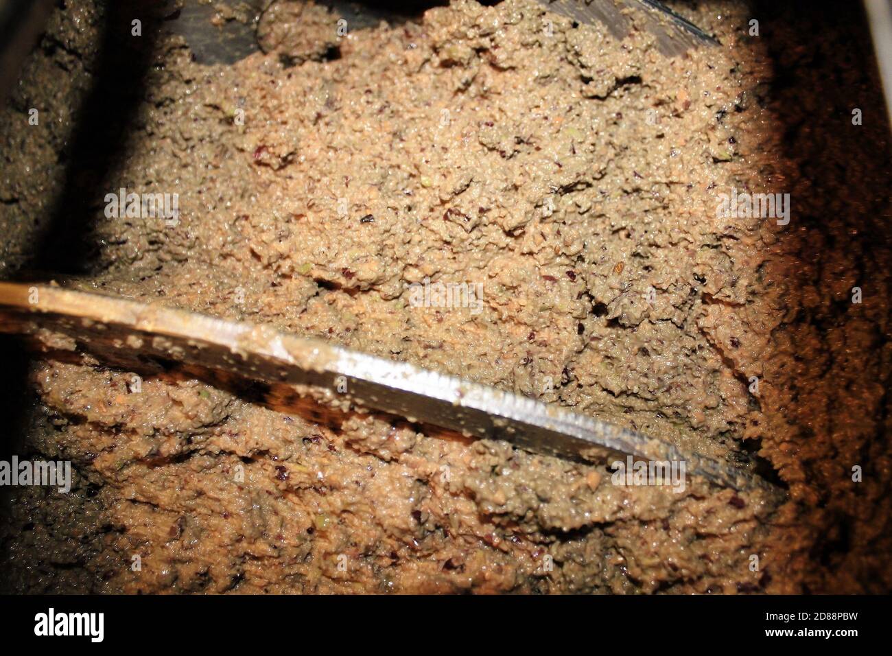 Greece, Attica, olive paste in malaxation tank during extra virgin ...