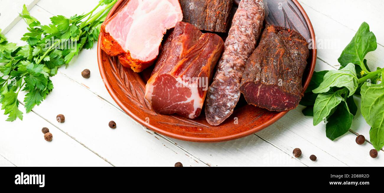 Italian meat platter.Cured meat and sausages.Smoked meat plate Stock ...