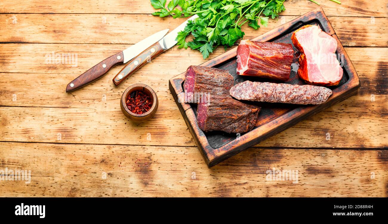 Spanish meat platter.Cured meat and sausages on cutting board Stock ...