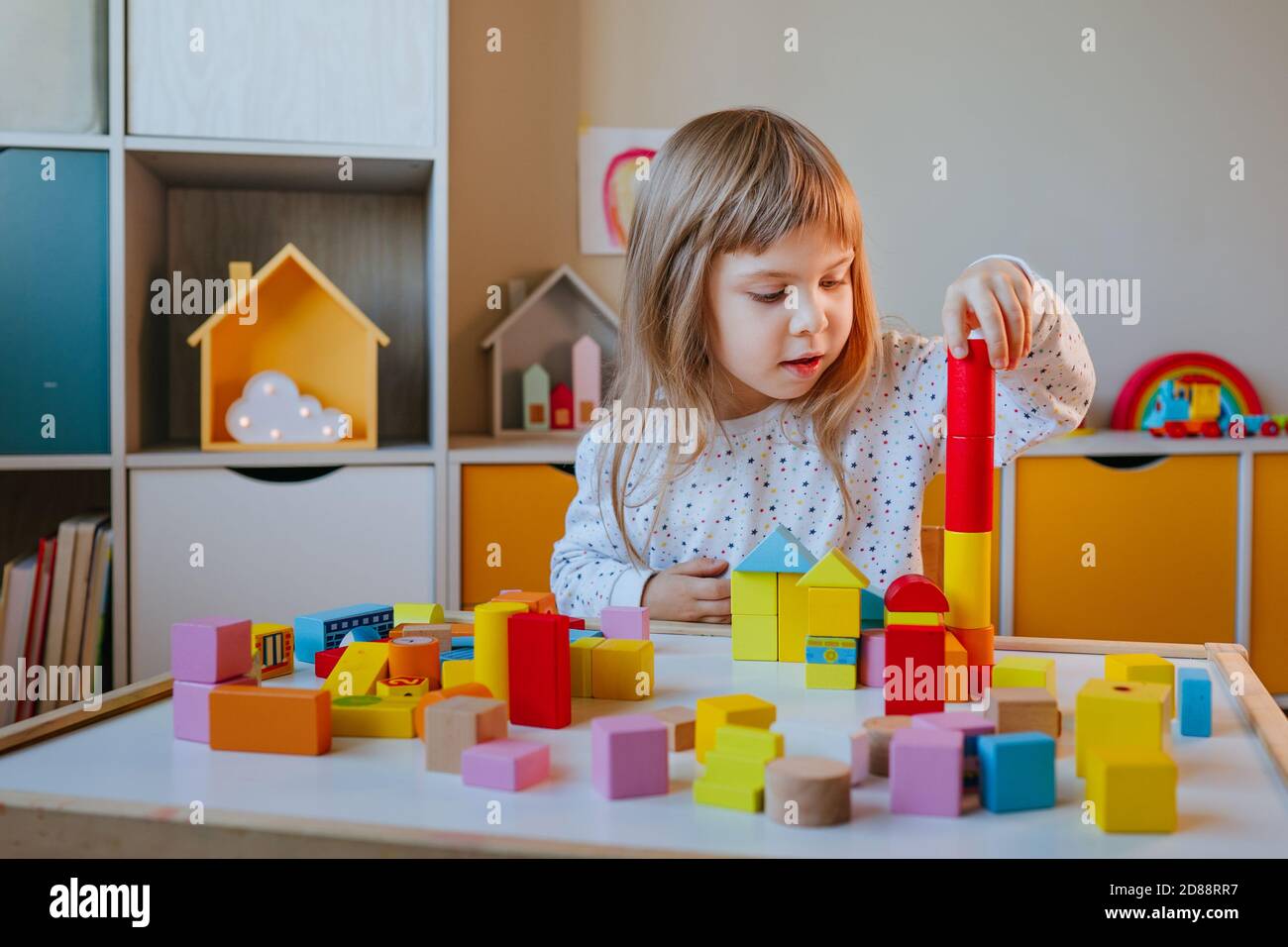 Happy children playing cubes hi-res stock photography and images - Alamy