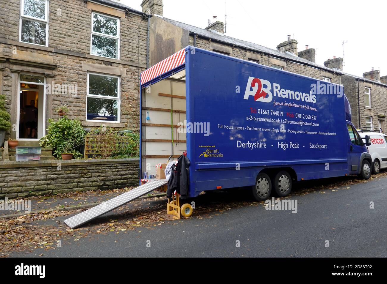 A removal van outside a house in New Mills, Derbyshire Stock Photo - Alamy