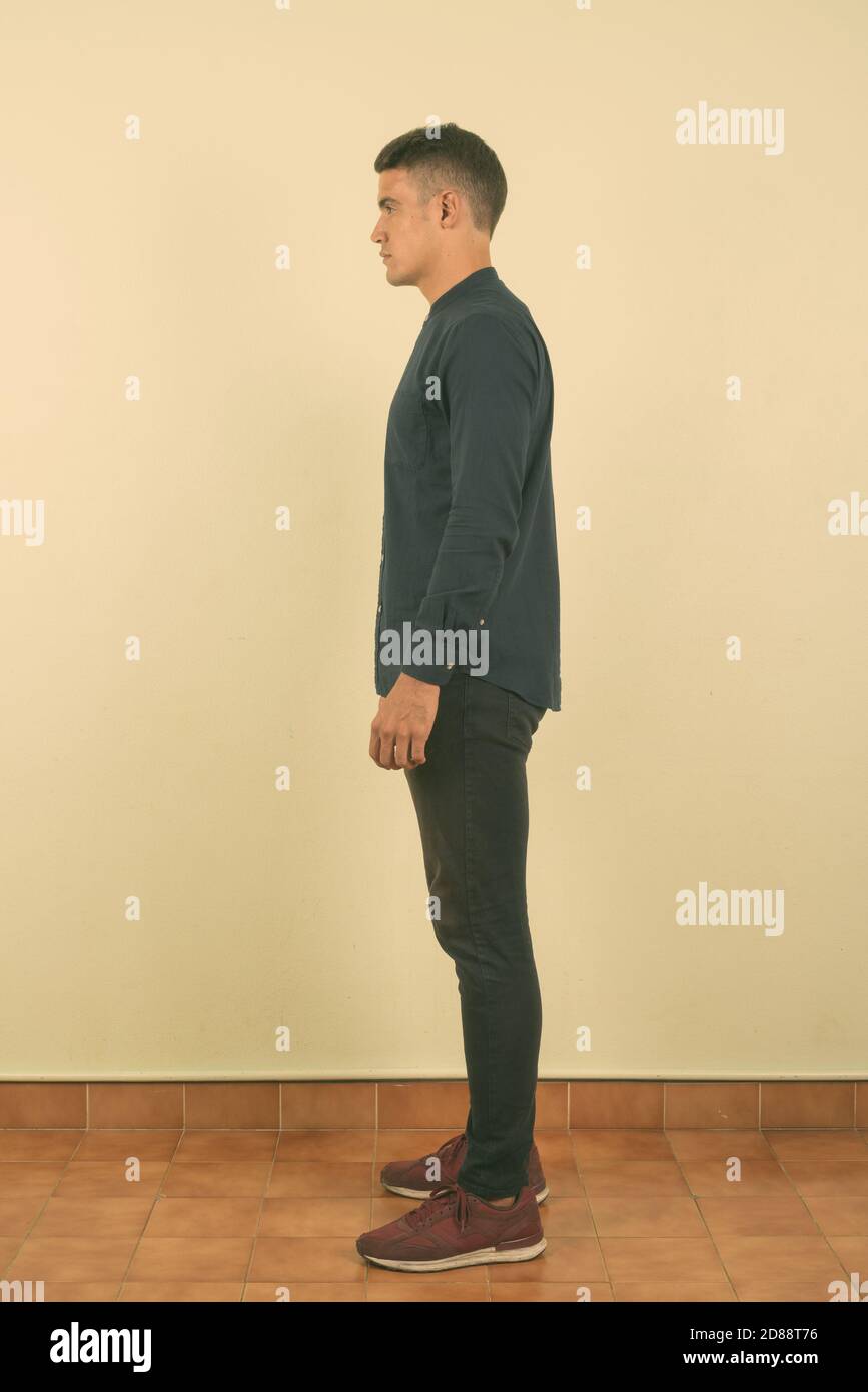 Full body shot profile view of young handsome businessman Stock Photo ...