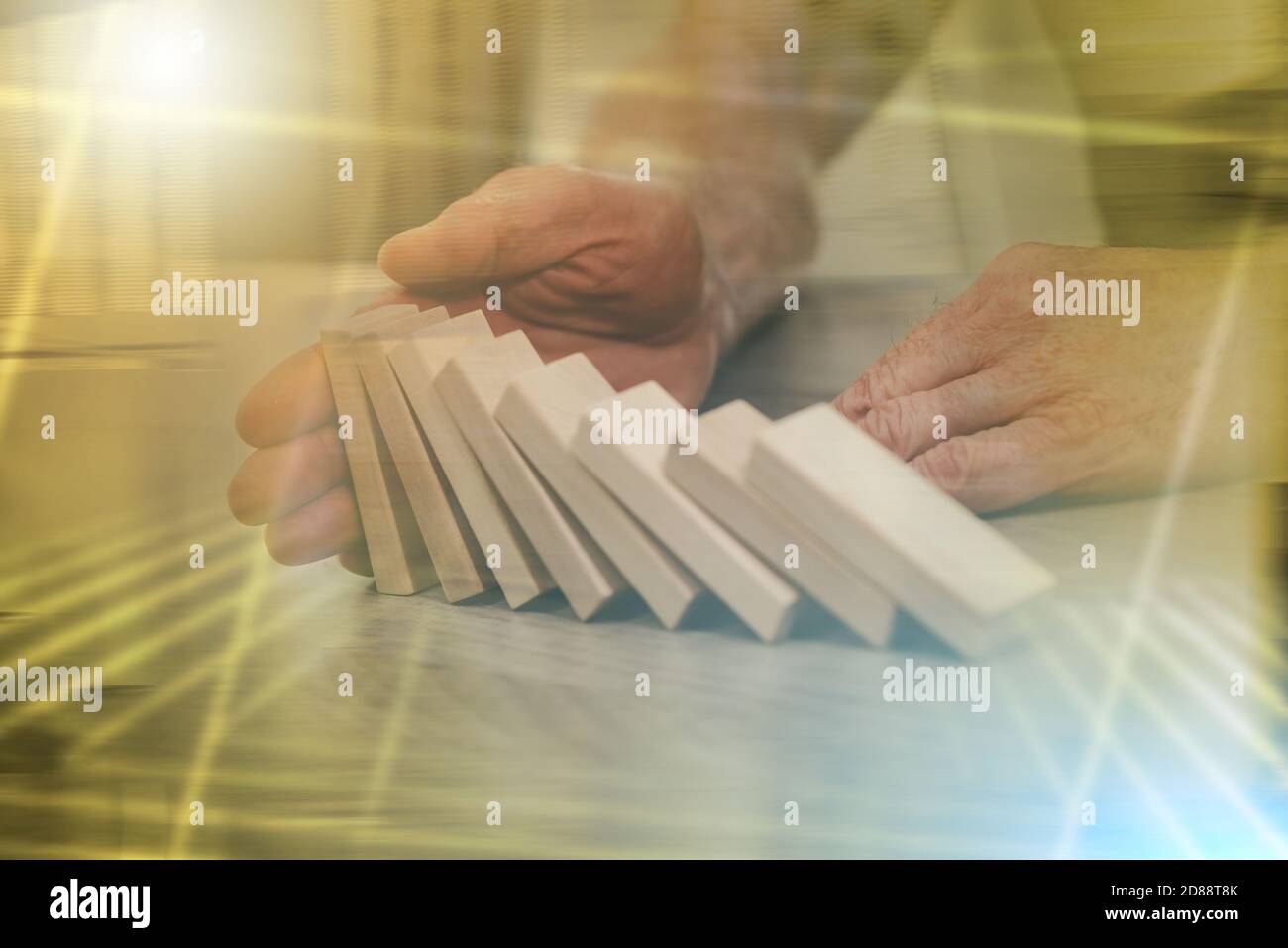 Business control concept by stopping domino effect; multiple exposure ...