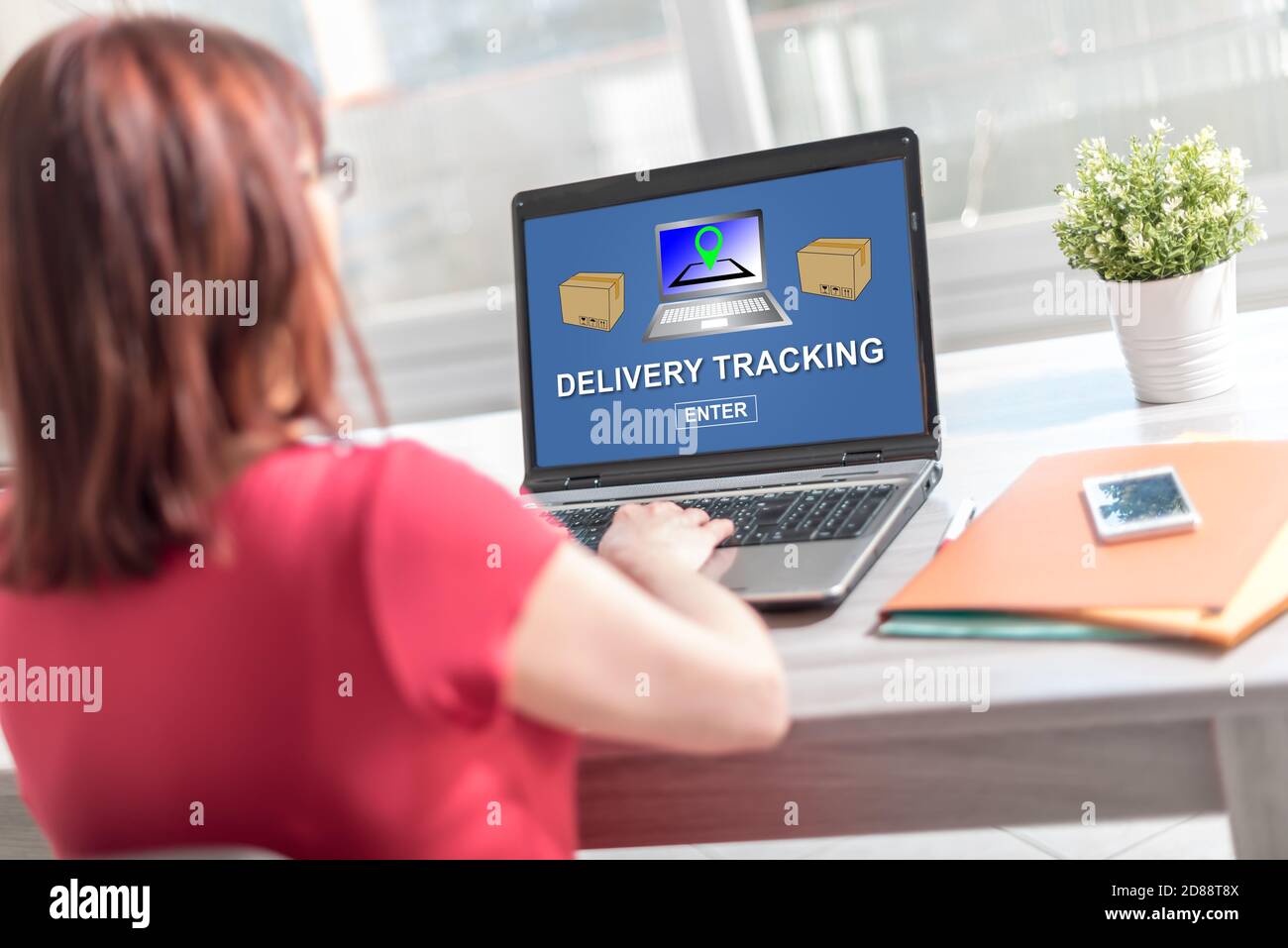 Laptop screen displaying a delivery tracking concept Stock Photo - Alamy