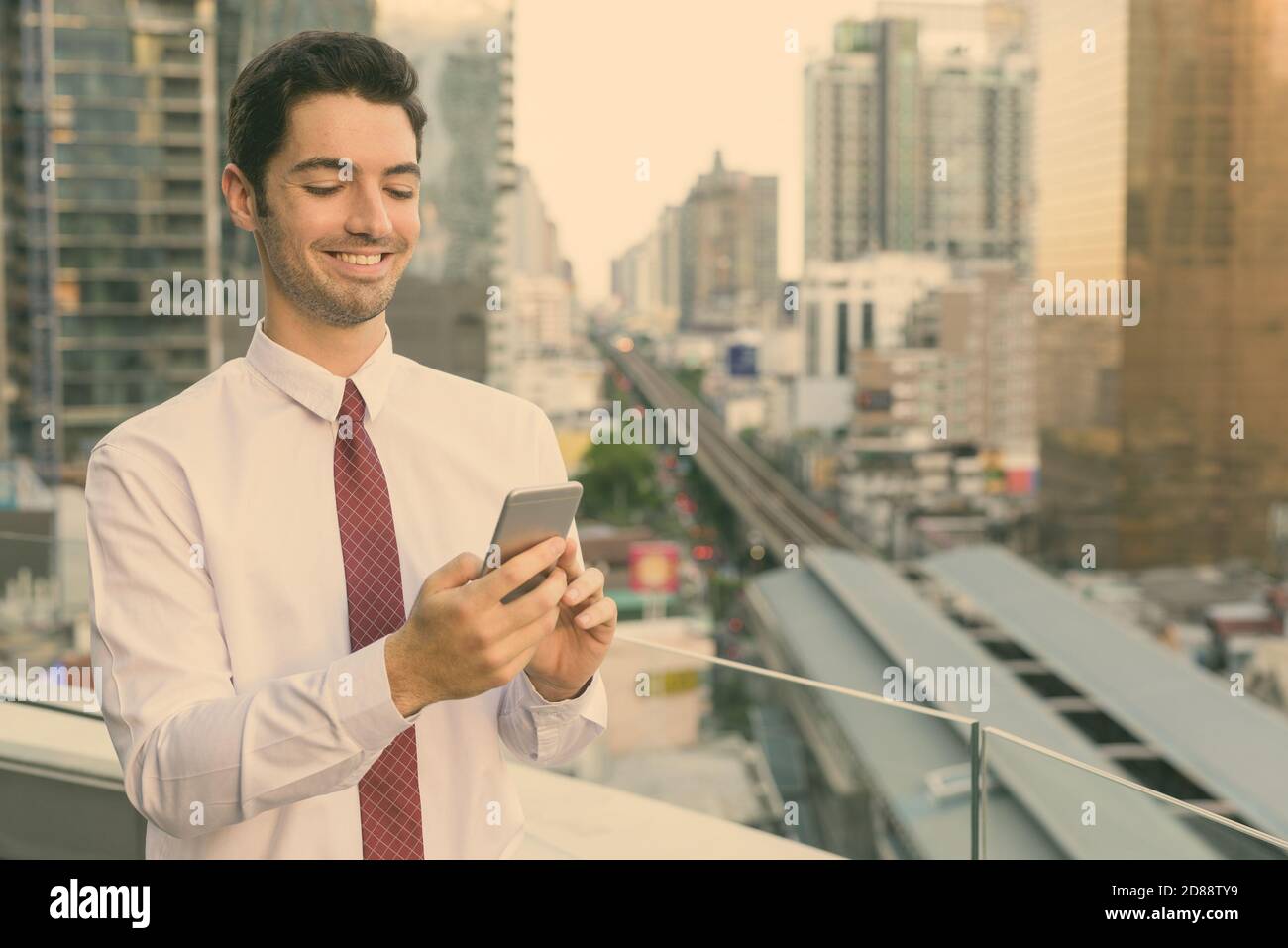 Young handsome businessman exploring the city of Bangkok, Thailand ...