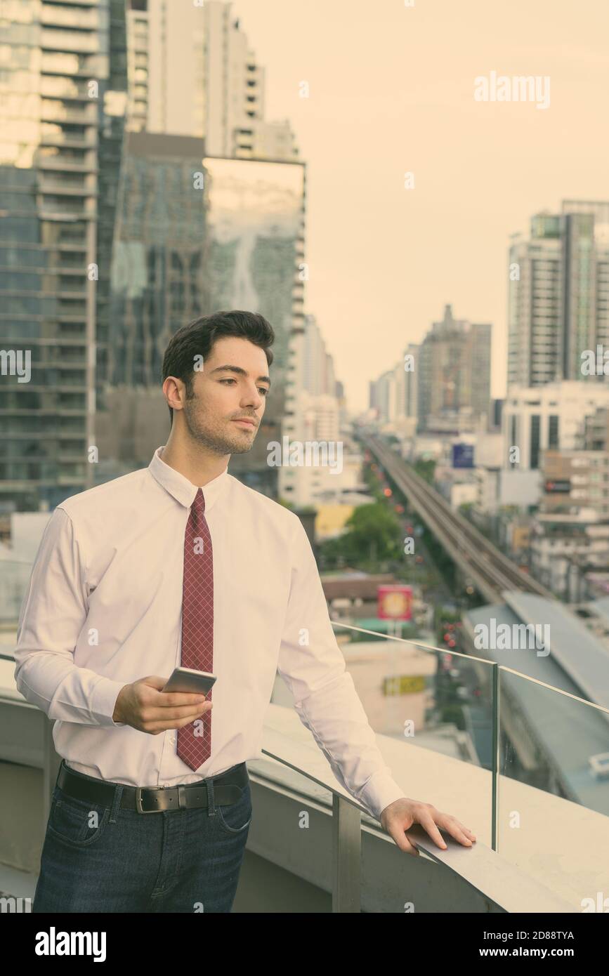 Young handsome businessman exploring the city of Bangkok, Thailand ...