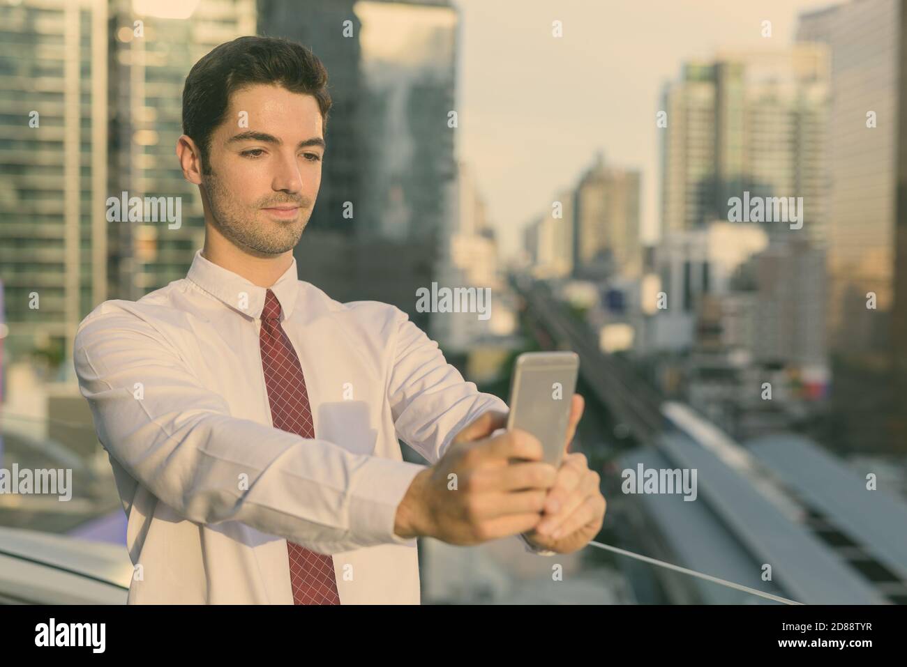 Young handsome businessman exploring the city of Bangkok, Thailand ...