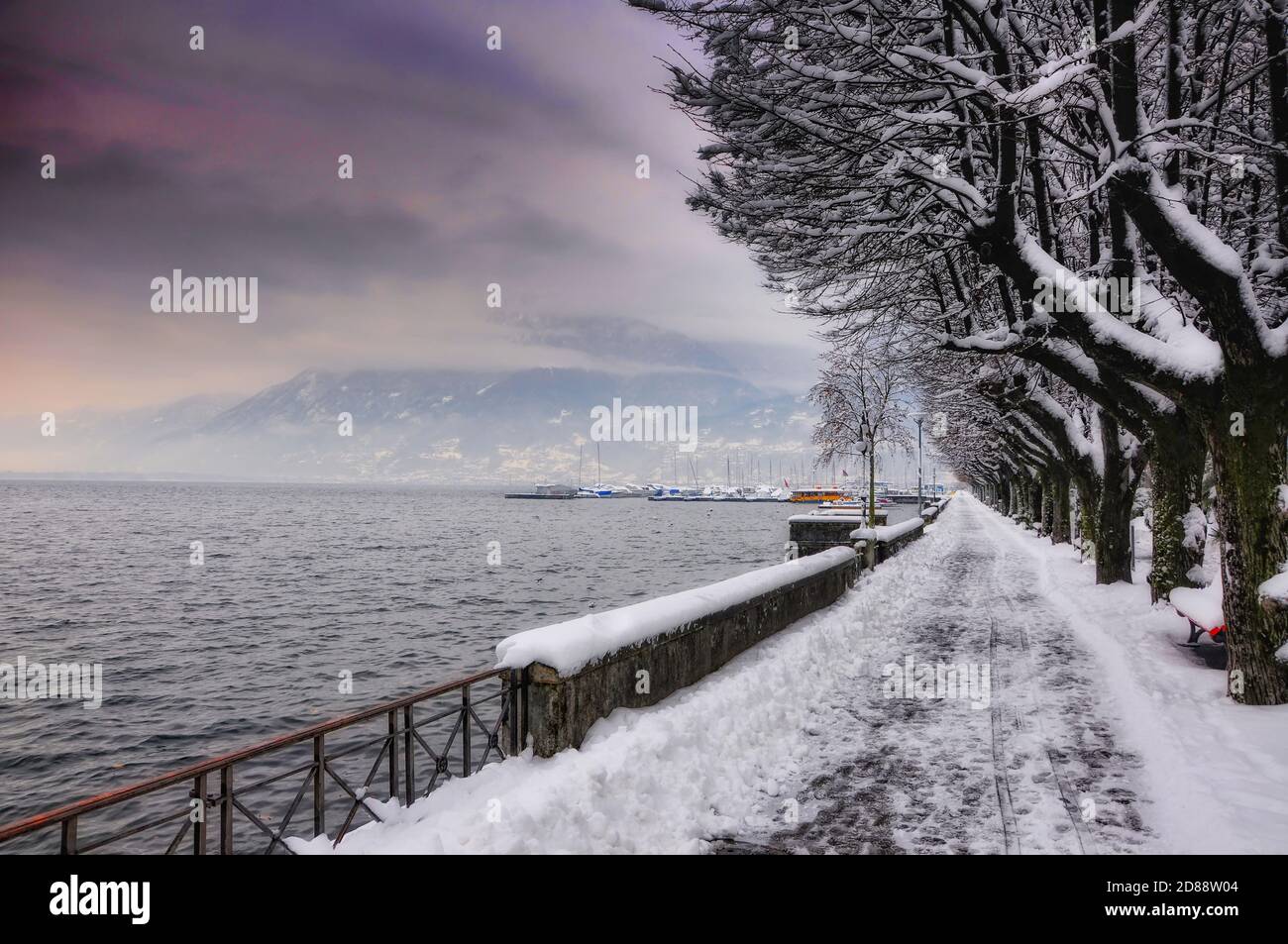 Walkway on the Waterfront with Bare Trees and Snow on Alpine Lake ...