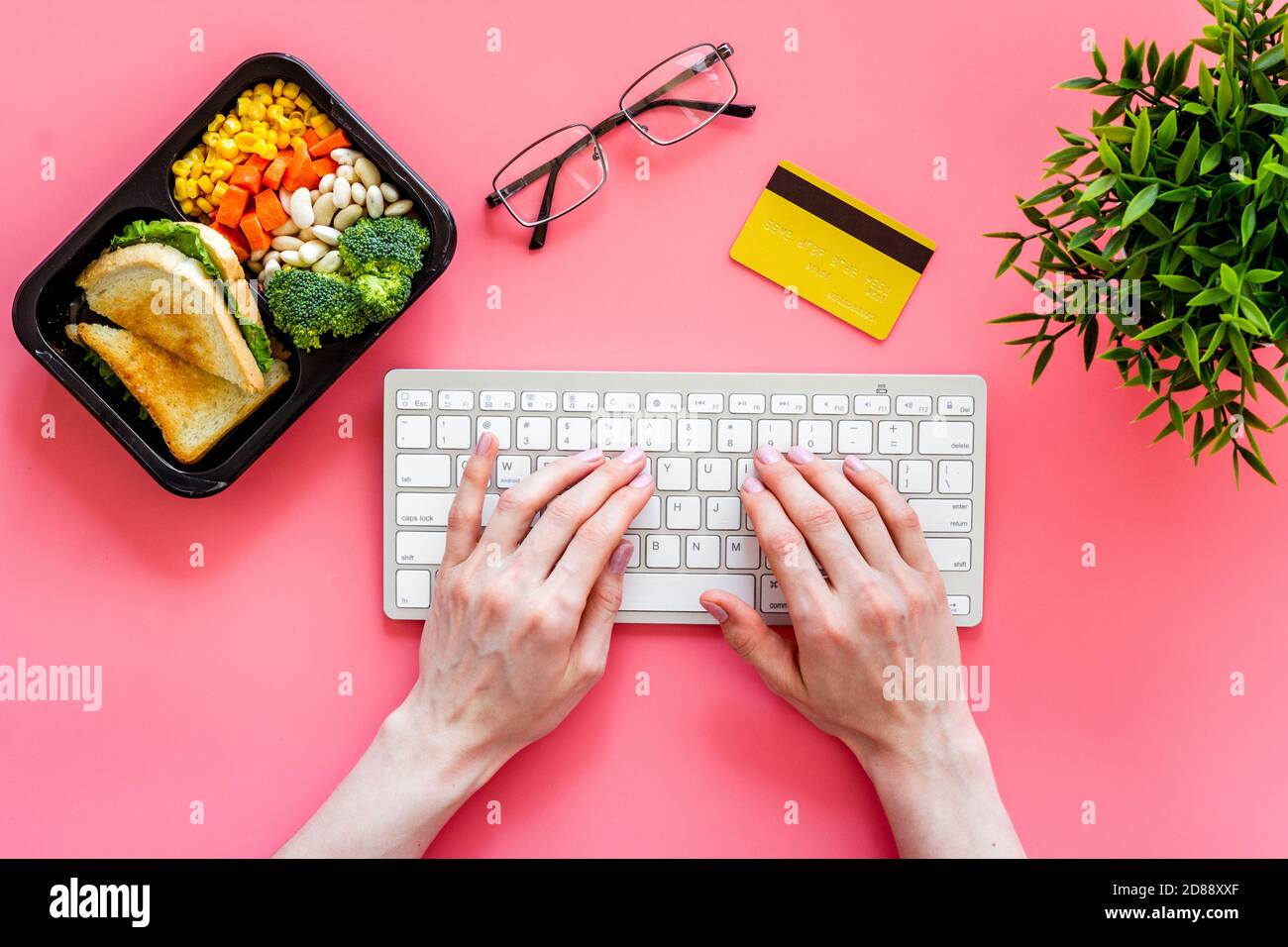 Woman using desktop app to order lunch with delivery Stock Photo - Alamy