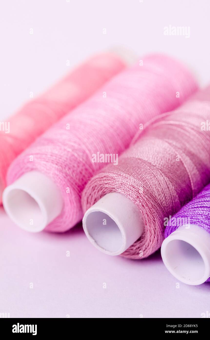 Pink spools threads in workshop hi-res stock photography and images - Alamy