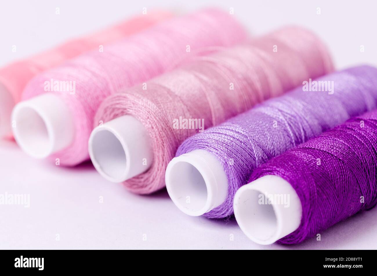 Pink spools threads in workshop hi-res stock photography and images - Alamy