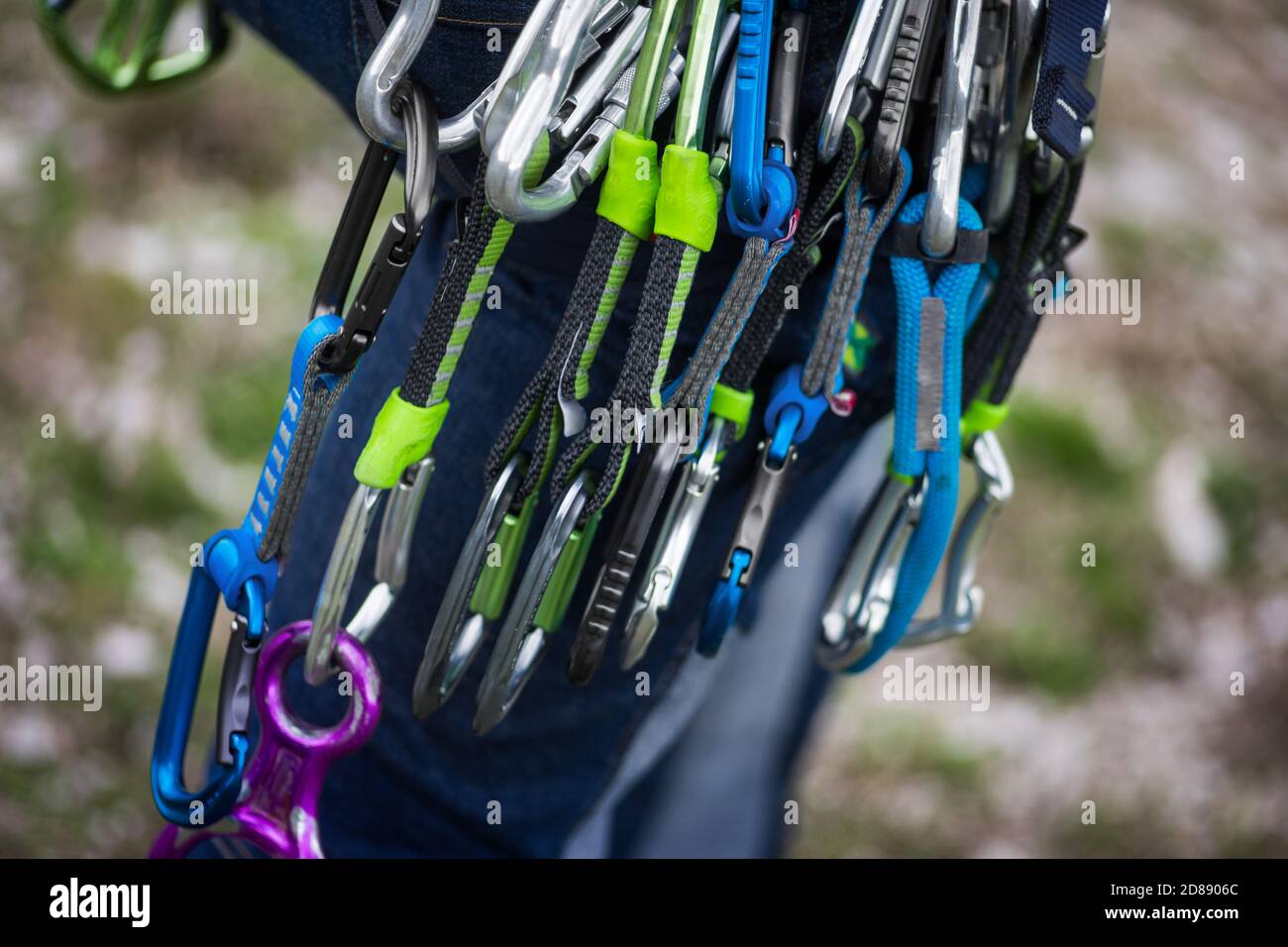 Various rock climbing gear attached to harness Stock Photo - Alamy