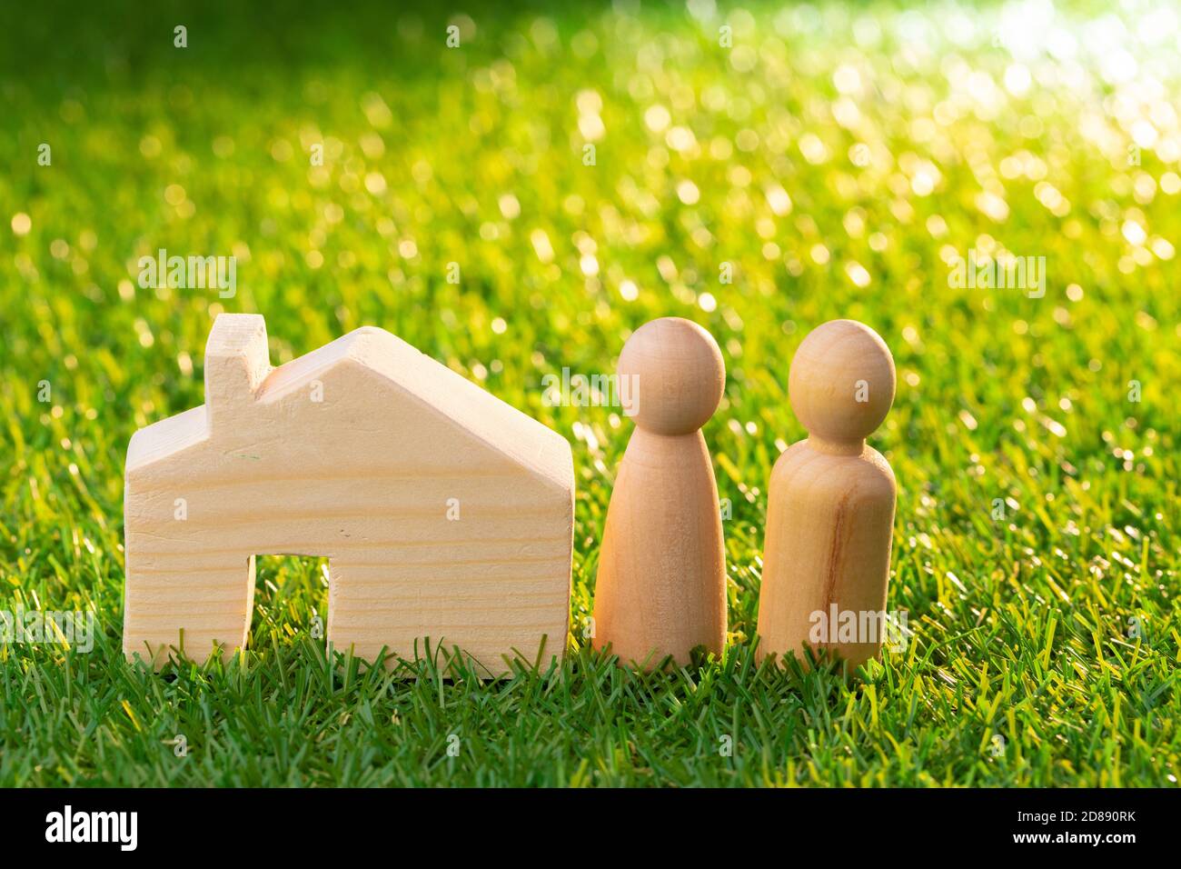 Wooden men figures and toy wooden house Stock Photo - Alamy