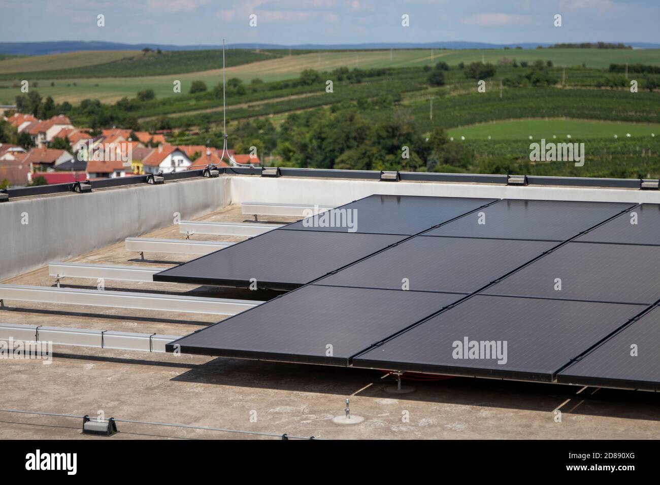 Solar panels at the top of the building. Solar modules on a flat roof ...