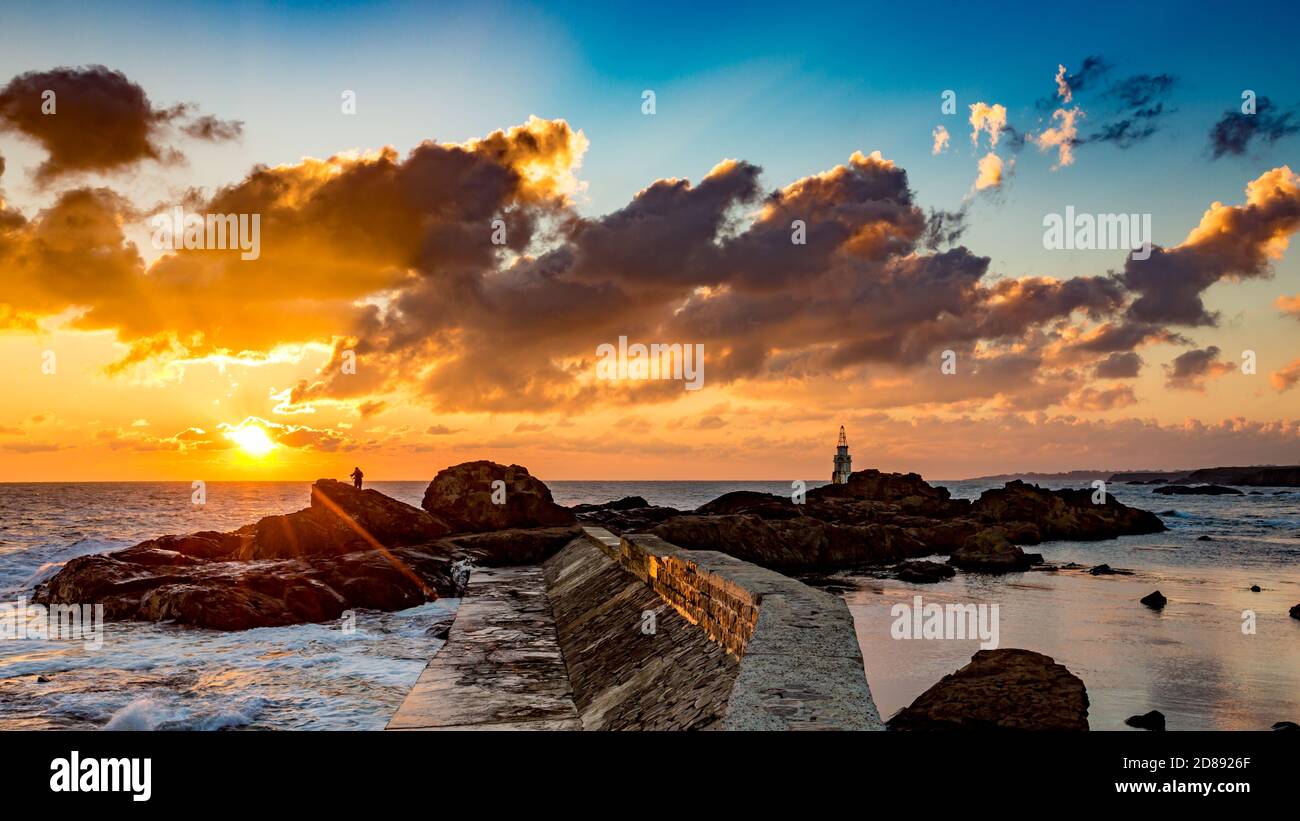 Photographer silhouette. Scenery amazing sunrise at Ahtopol lighthouse ...