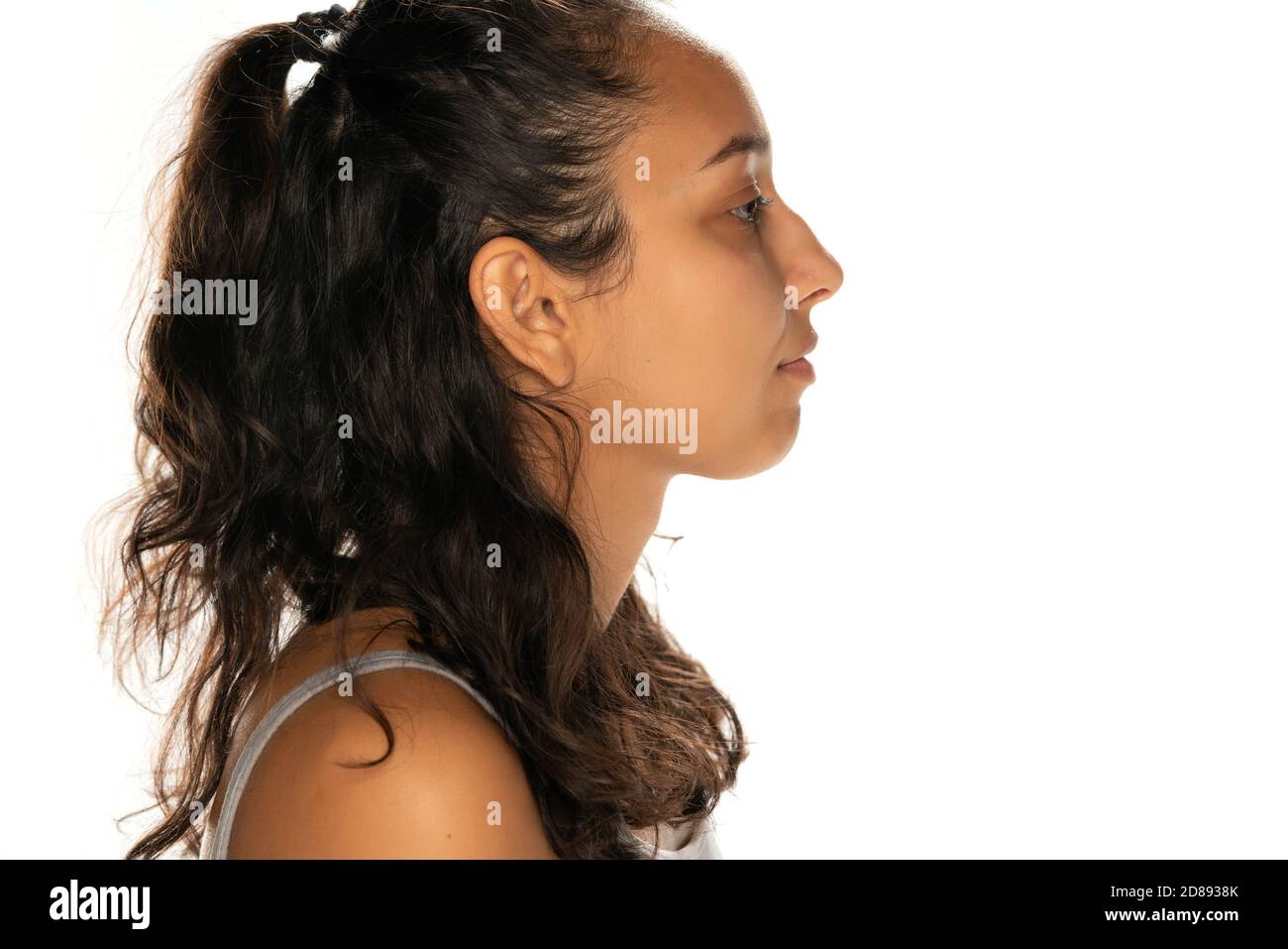 Profile of serious young mexican woman on white background Stock Photo ...