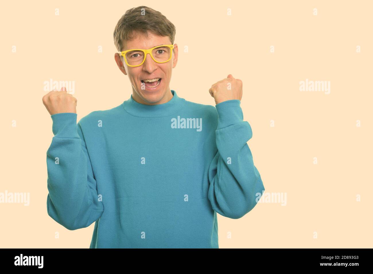 Man smiling raised fists glasses hi-res stock photography and images ...