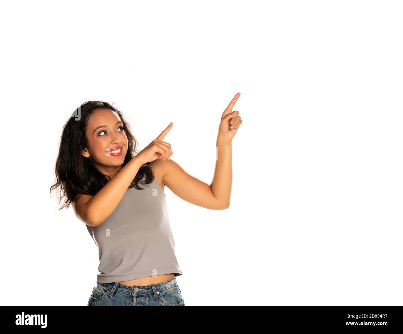 Happy dark skinned woman pointing on white background Stock Photo - Alamy