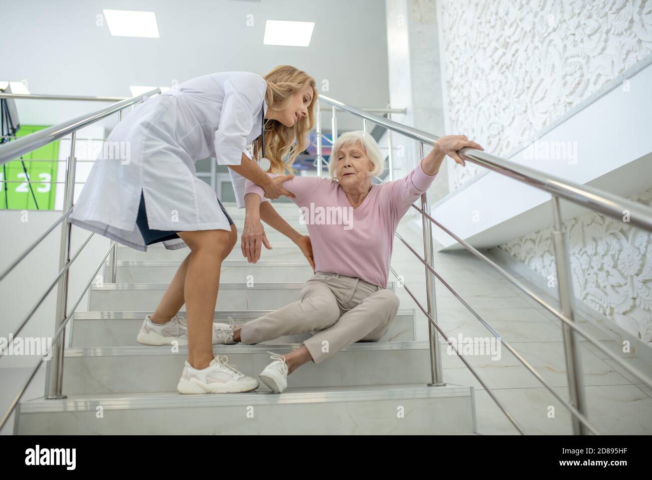 Woman falling down stairs hi-res stock photography and images - Alamy