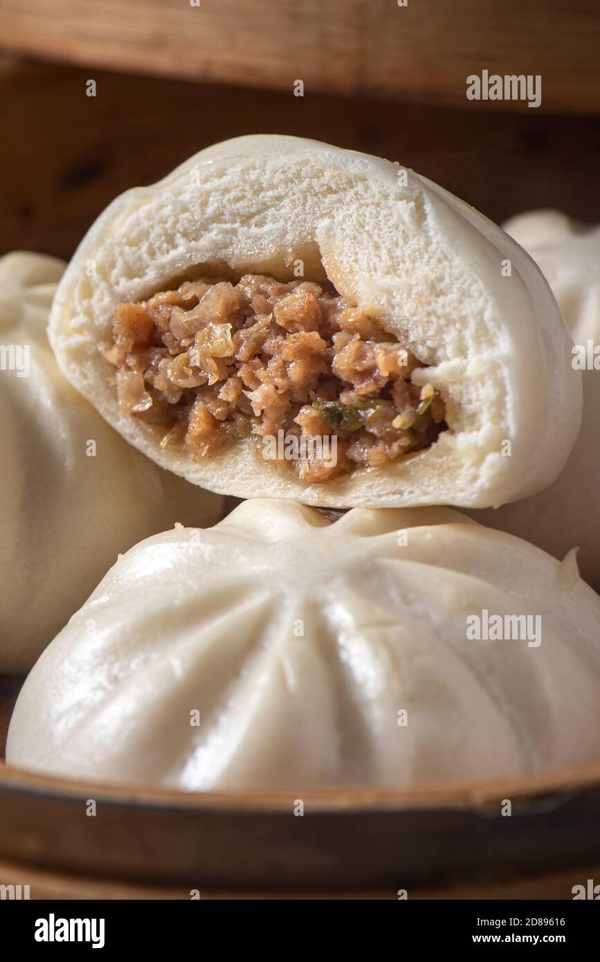 Close up of fresh delicious baozi, Chinese steamed meat bun is ready to ...