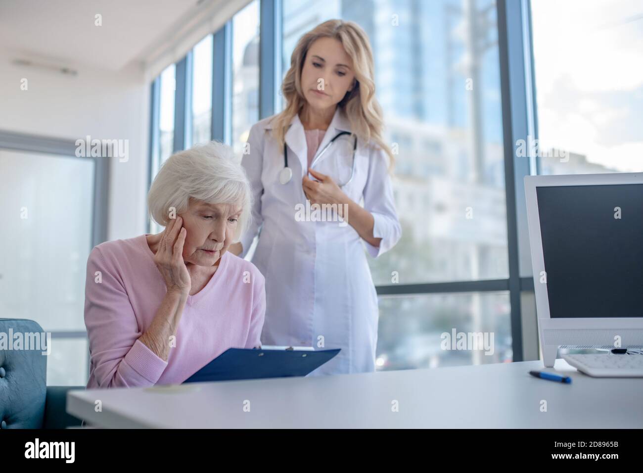 Elderly patient feeling shocked after reading the test results Stock ...