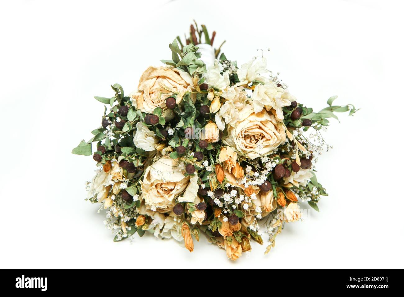 The dried wedding bouquet of roses and other flowers. A saved memory ... The dried wedding bouquet of roses and other flowers. A saved memory ...