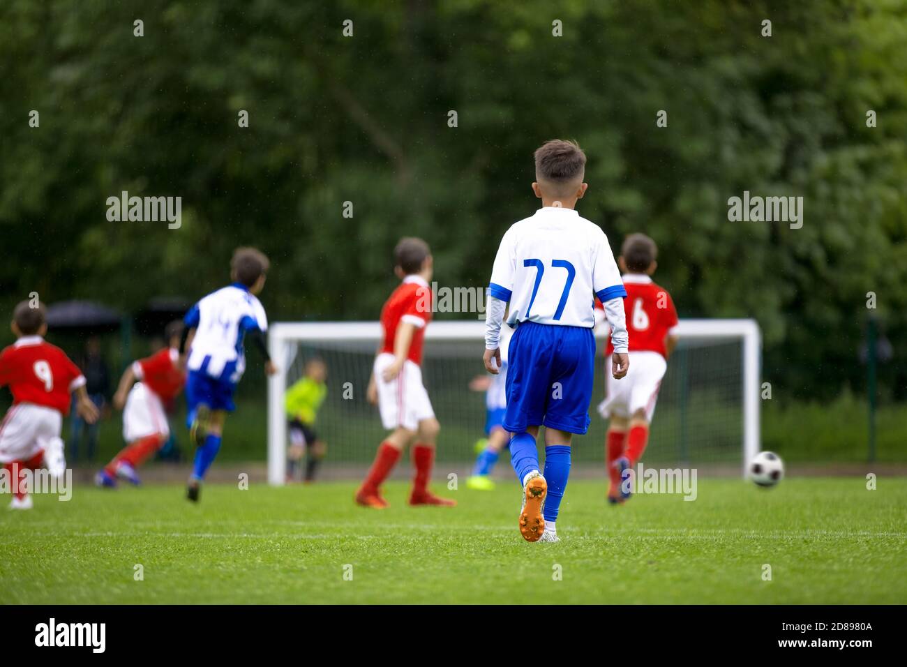 Soccer Kids Playing Game. Happy Children Kicking Football Tournament ...