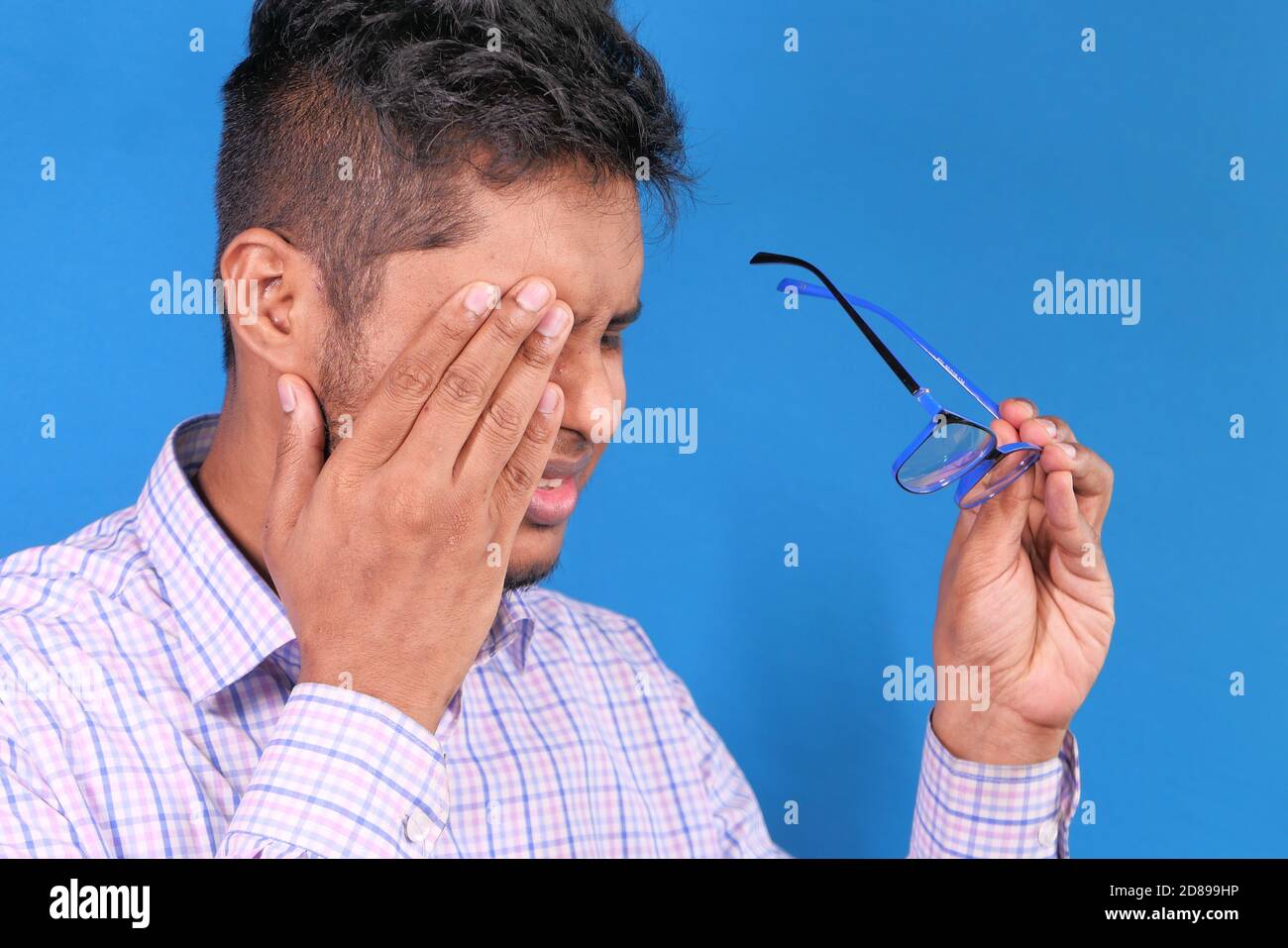 Close up of upset man suffering from strong eye pain Stock Photo - Alamy