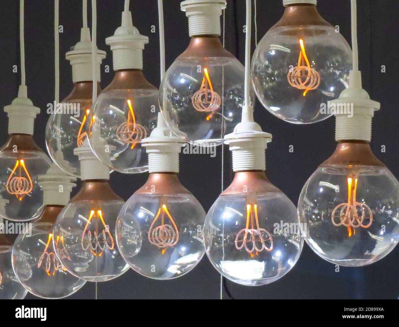 Lightbulbs hanging from ceiling hi-res stock photography and images - Alamy