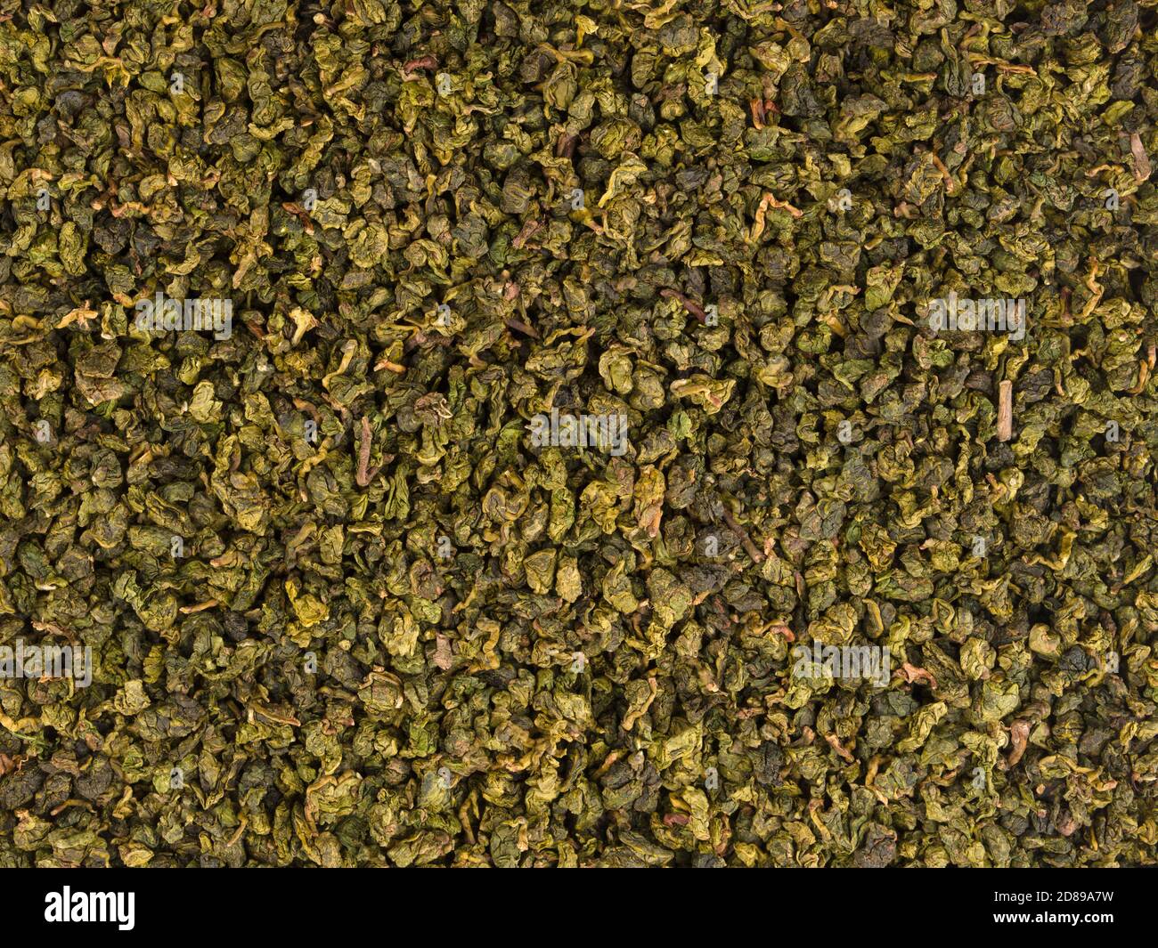 Dry green oolong tea leaves texture background Stock Photo - Alamy