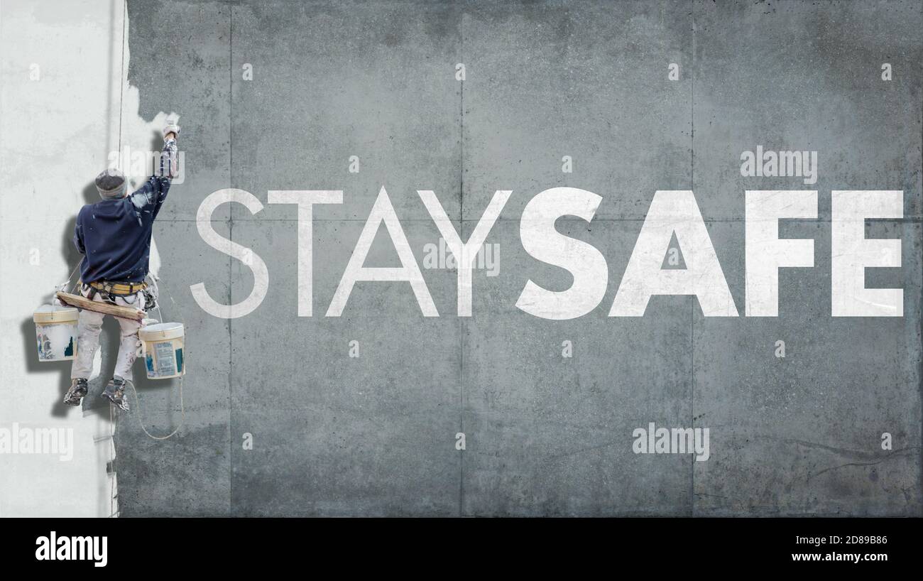Stay safe campaign painted on a building facade Stock Photo - Alamy