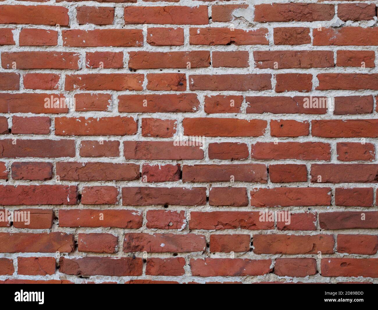 Red aged brick wall texture background Stock Photo - Alamy