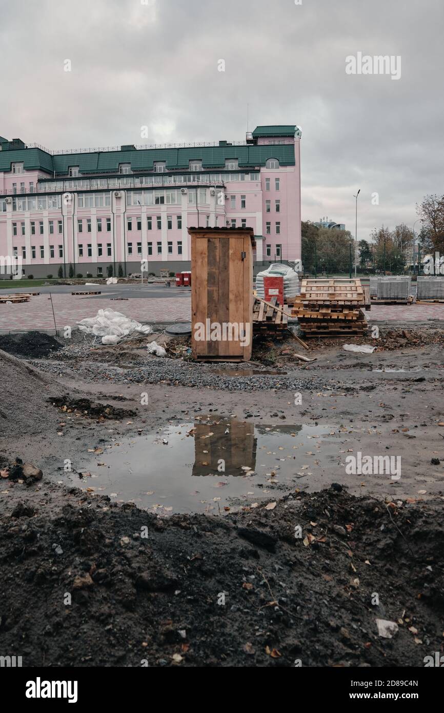 typical ukrainian street toilet on the background of an expensive ...