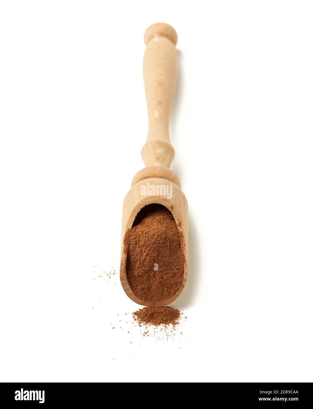 brown ground cinnamon in a wooden spoon, spice isolated on white ...