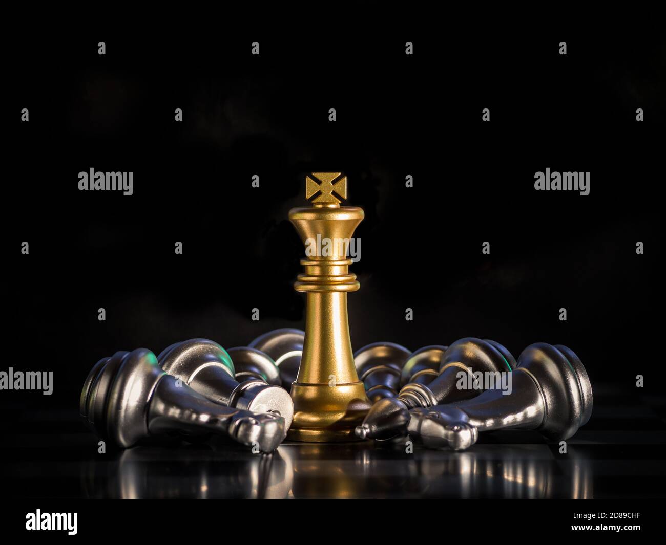 Golden king chess is surrounded by falling around silver chess pieces ...