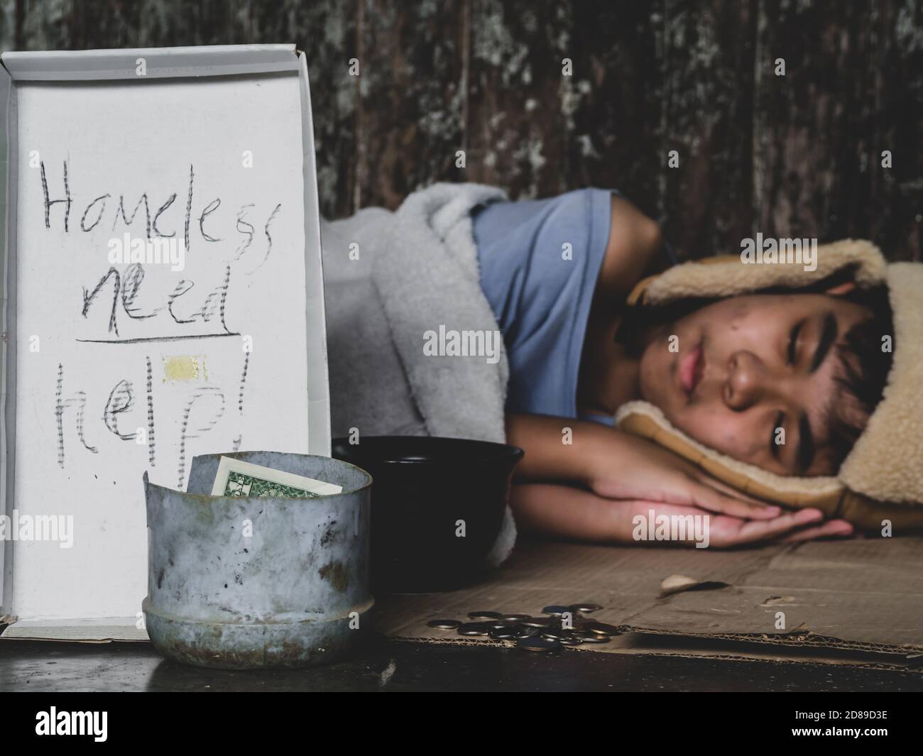 Hungry child lay down on street with hungry and asking help food or ...