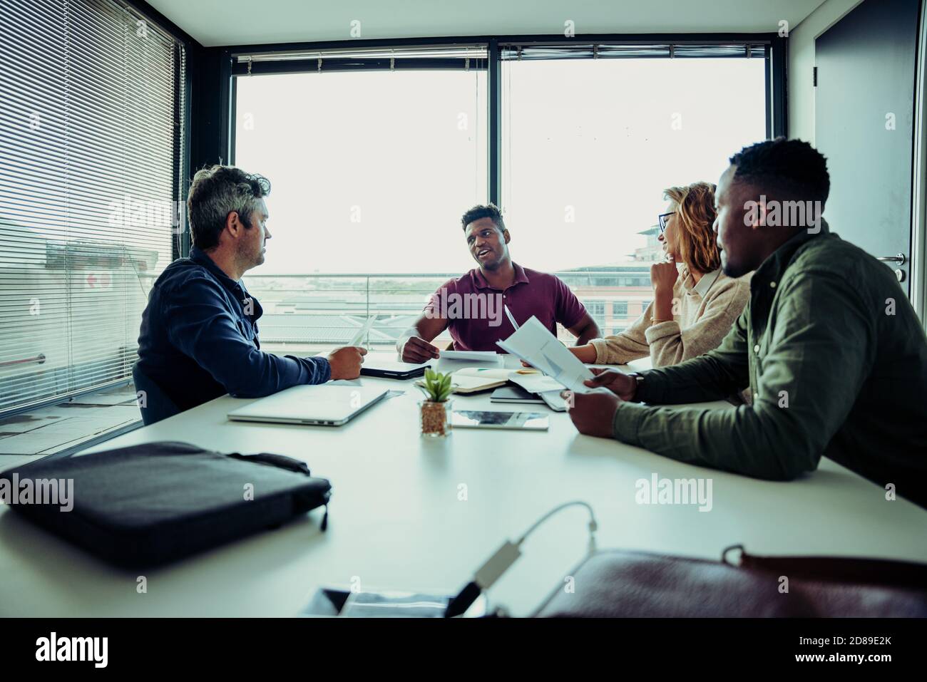 Gathered around table hi-res stock photography and images - Alamy