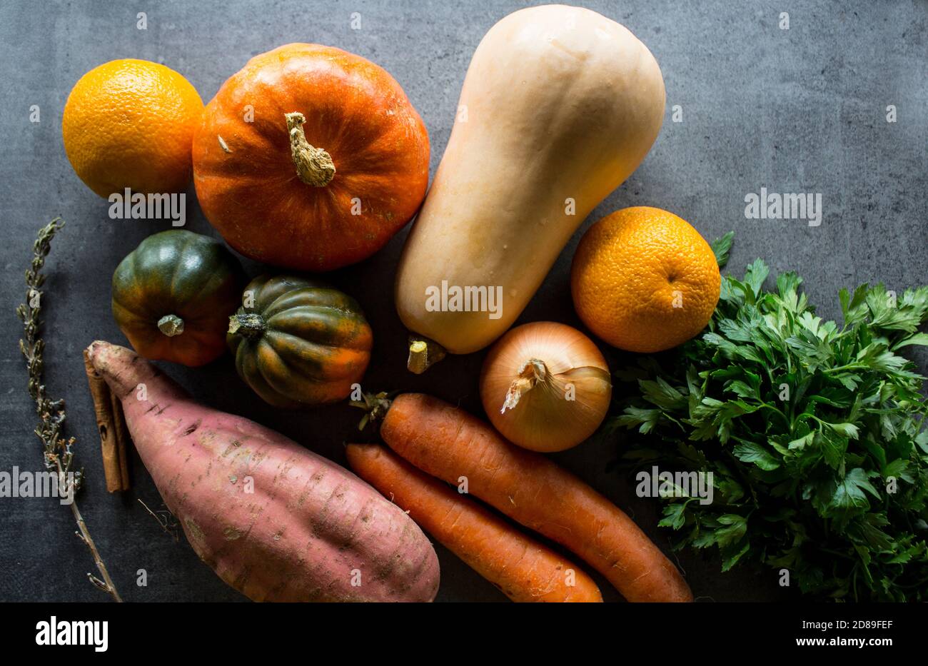 Fresh autumn vegetables on grey table. Top view photo of butternut ...