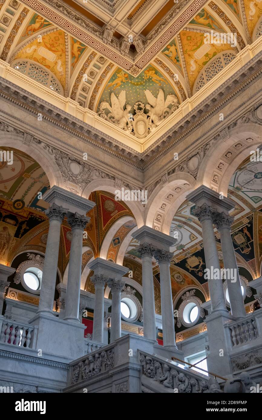 Pairs of columns at the top of the grand staircase support the vaulted ceiling above the Great ...