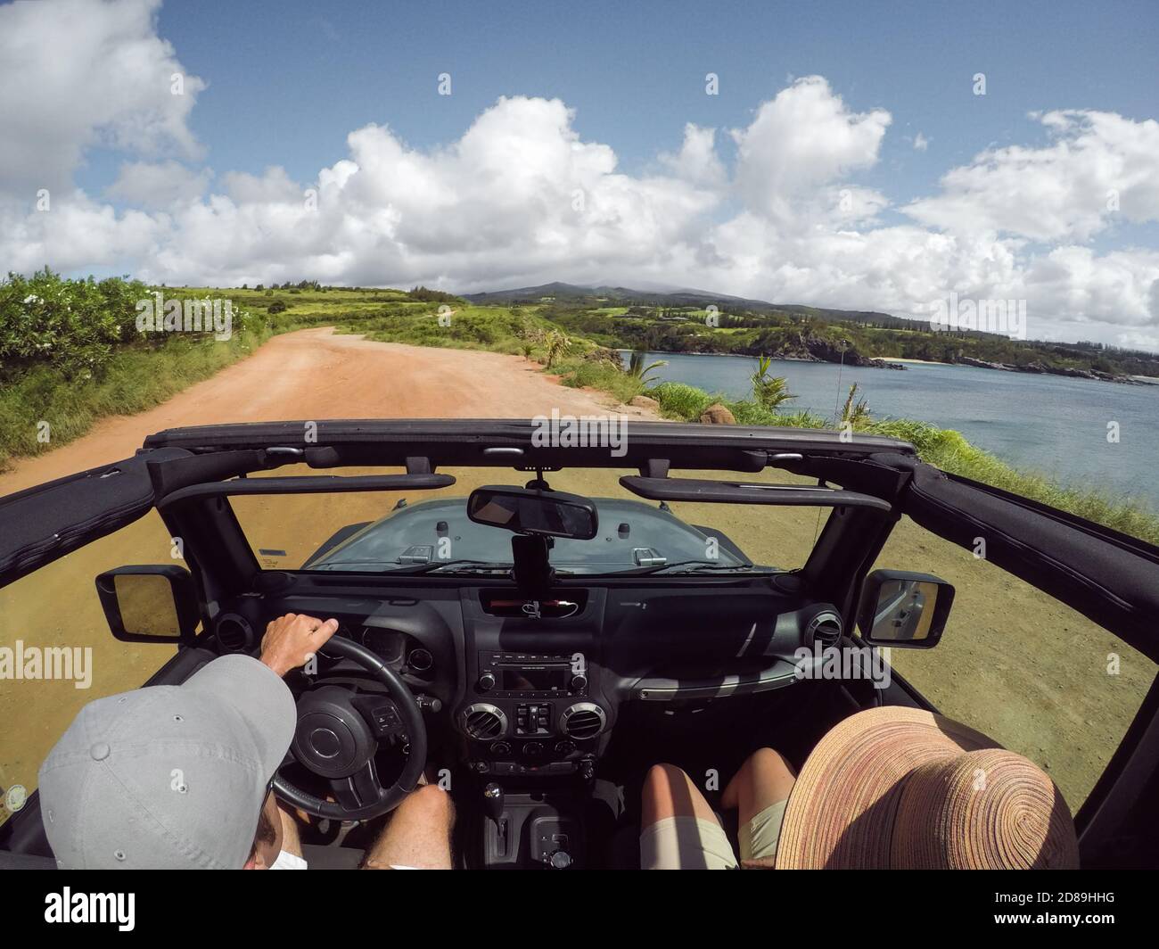 Rear view of a couple driving a convertible car, Maui, Hawaii, USA ...