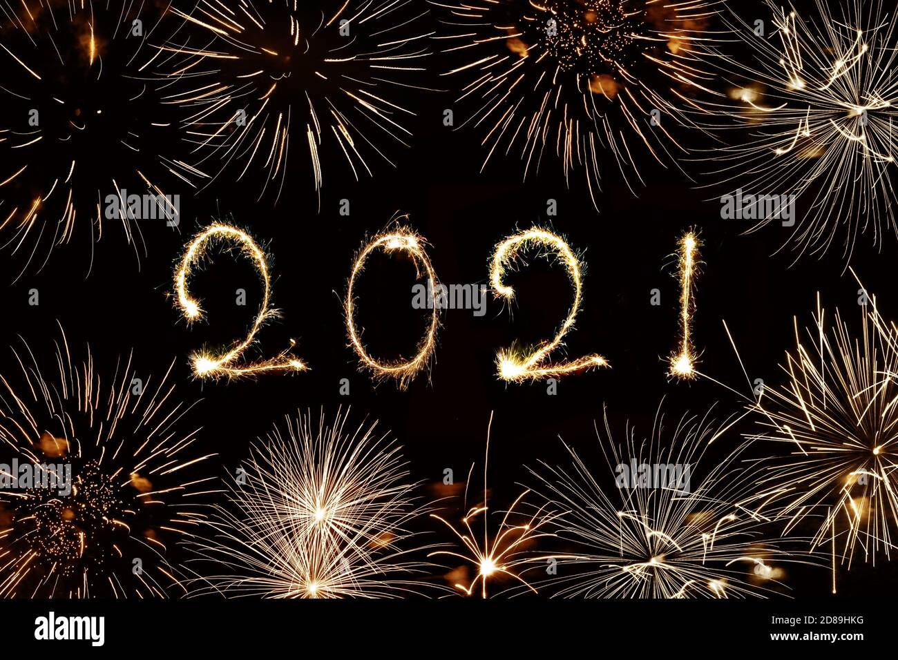 2021 written with sparkles and fireworks Stock Photo - Alamy