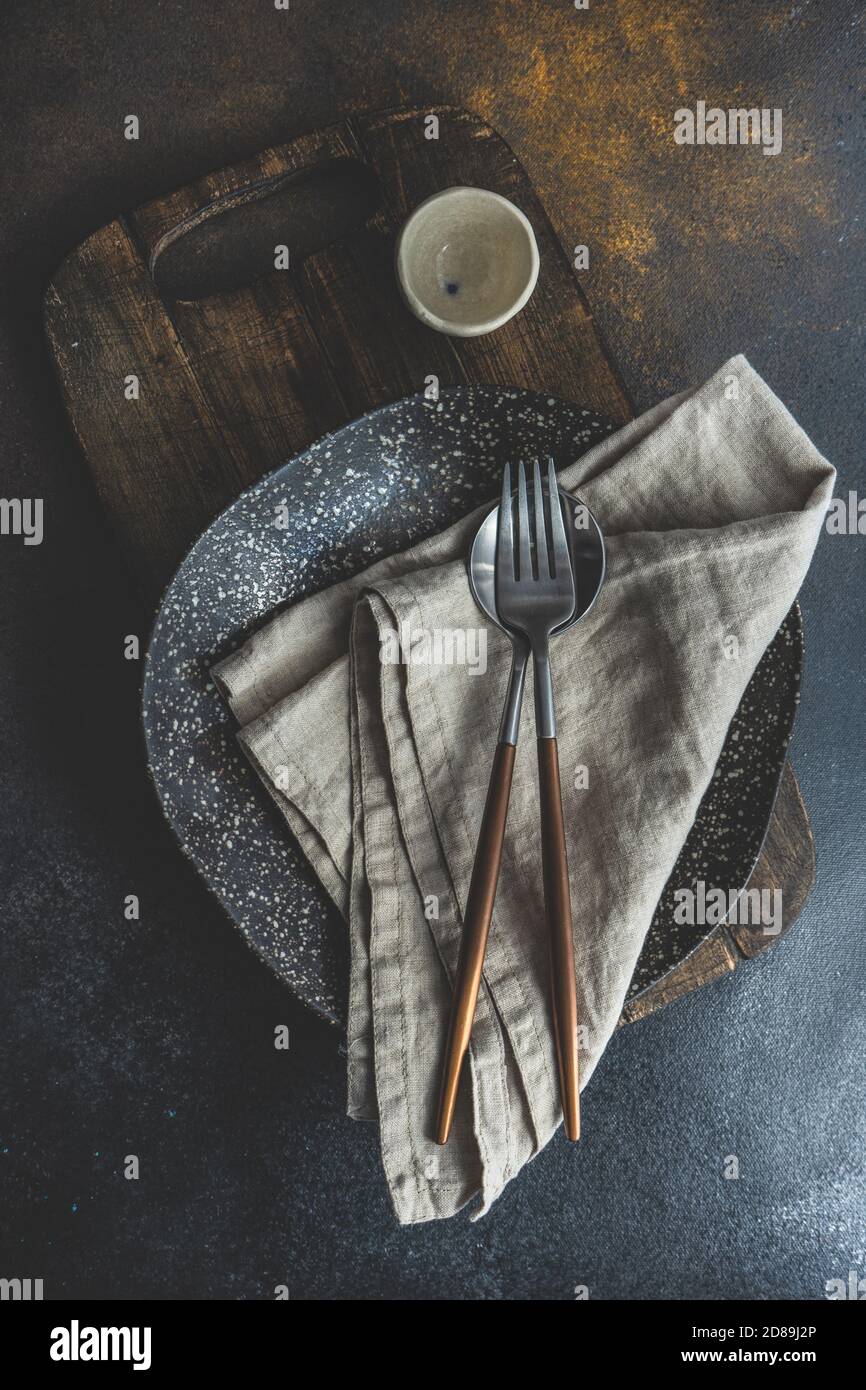 Overhead view of a rustic place setting on a chopping board Stock Photo ...