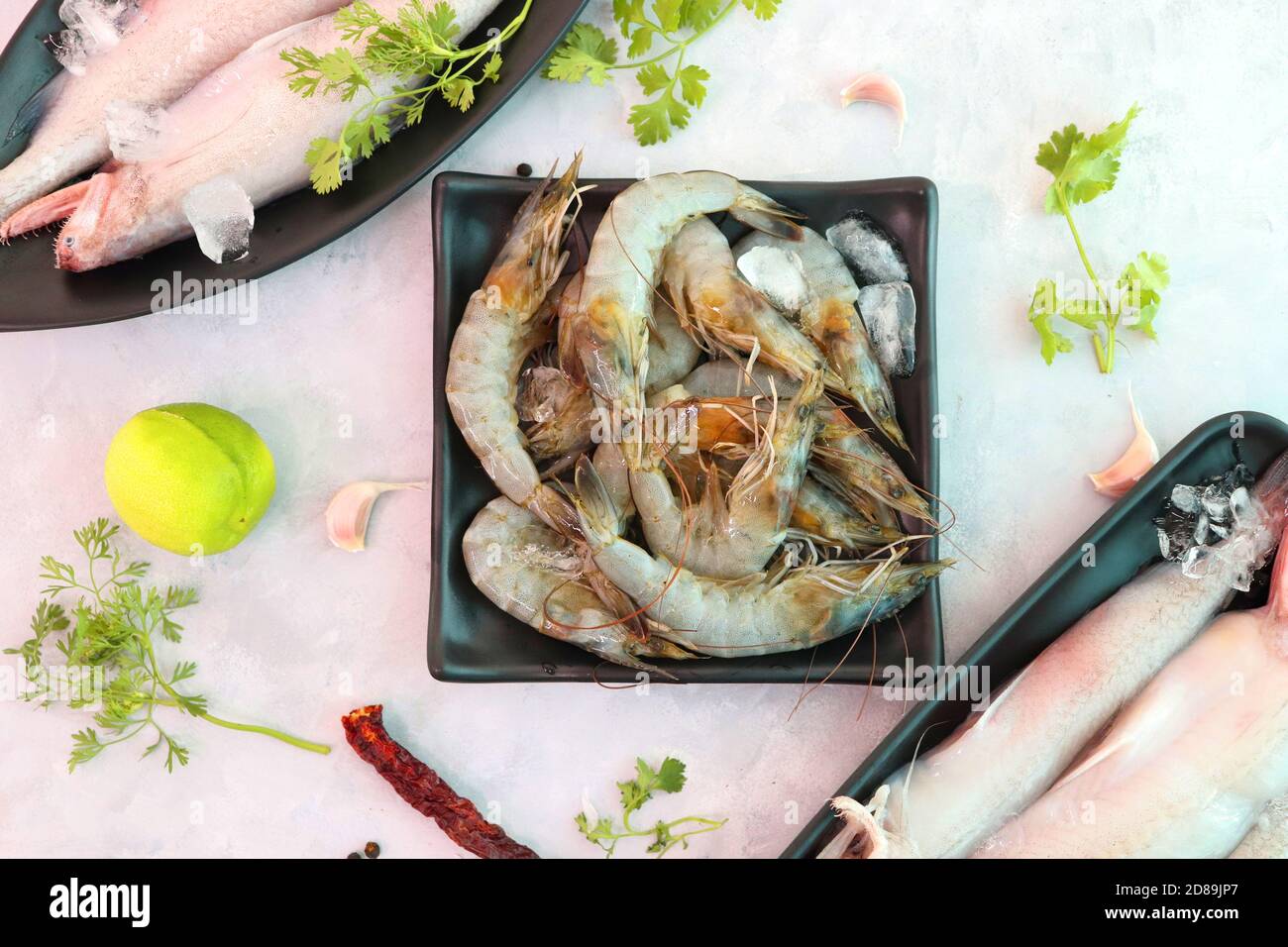 Fresh sea fish Bombay duck or Bombil and ingredients for cooking, green ...