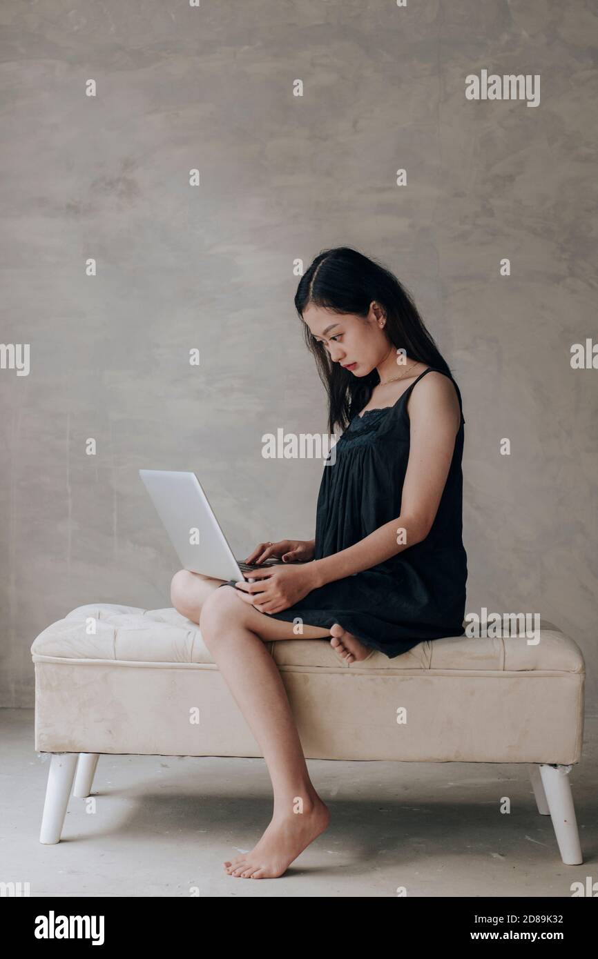 Asian beautiful woman thinking idea with laptop computer Stock Photo ...
