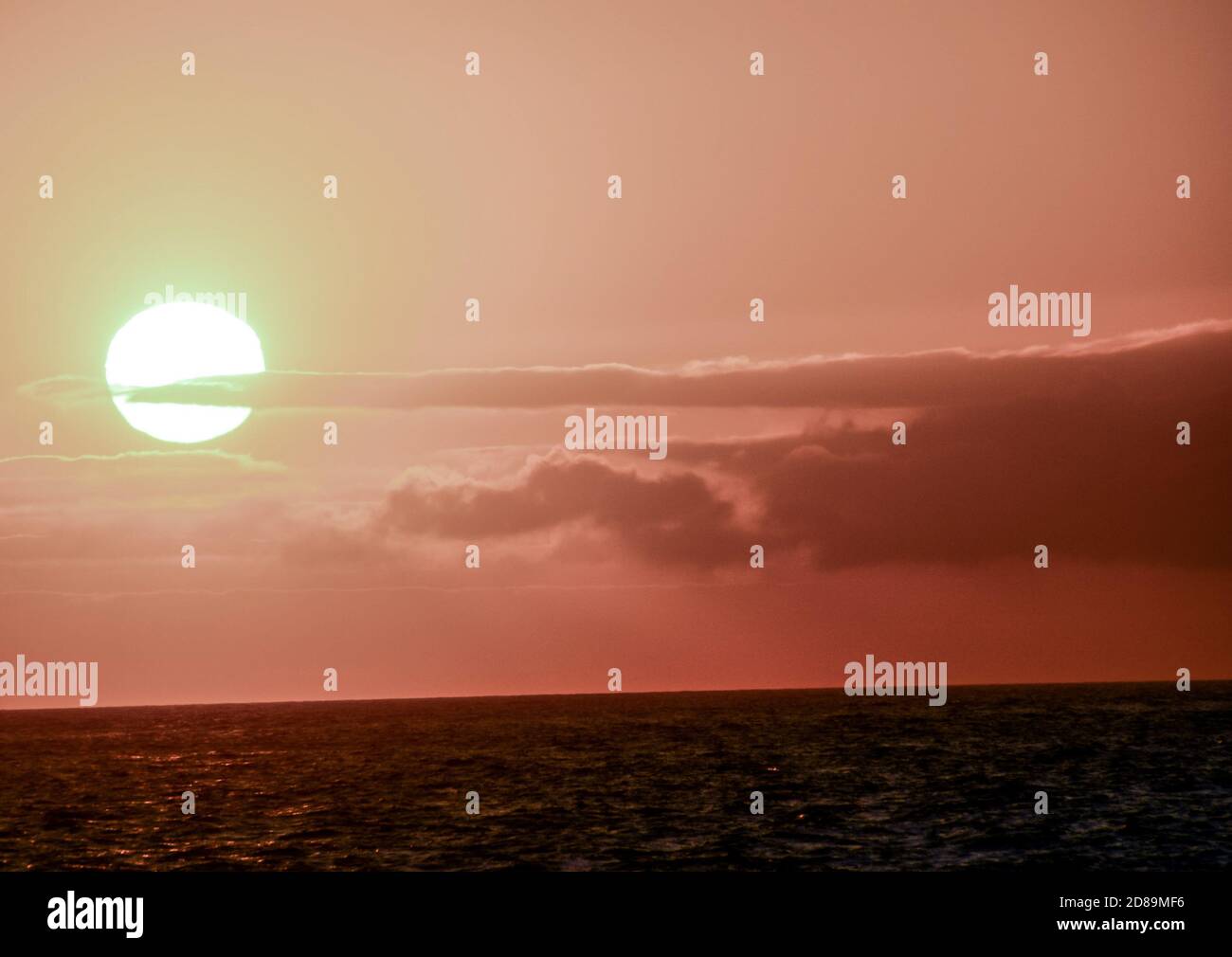 The Sun Setting in the Sea Stock Photo - Alamy